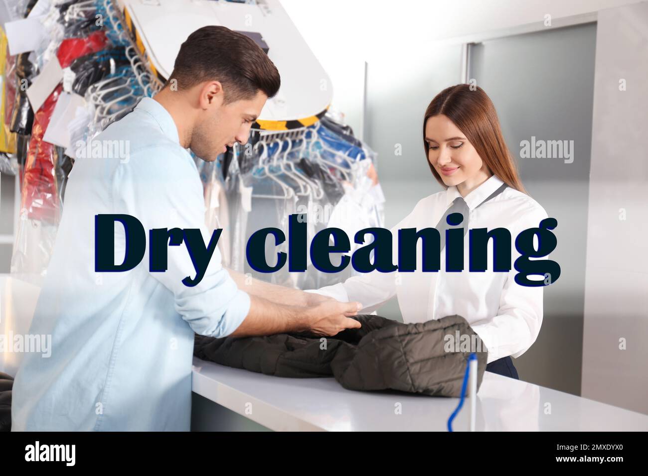 Client and worker with jacket at modern dry-cleaner's Stock Photo - Alamy