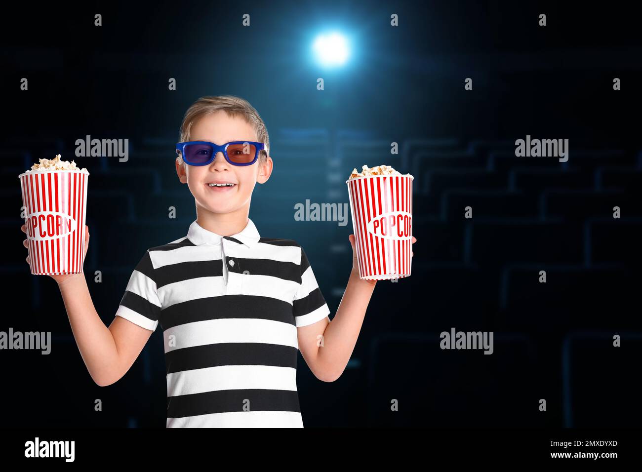 Cute boy in 3D glasses with popcorn buckets in cinema, space for text Stock Photo - Alamy