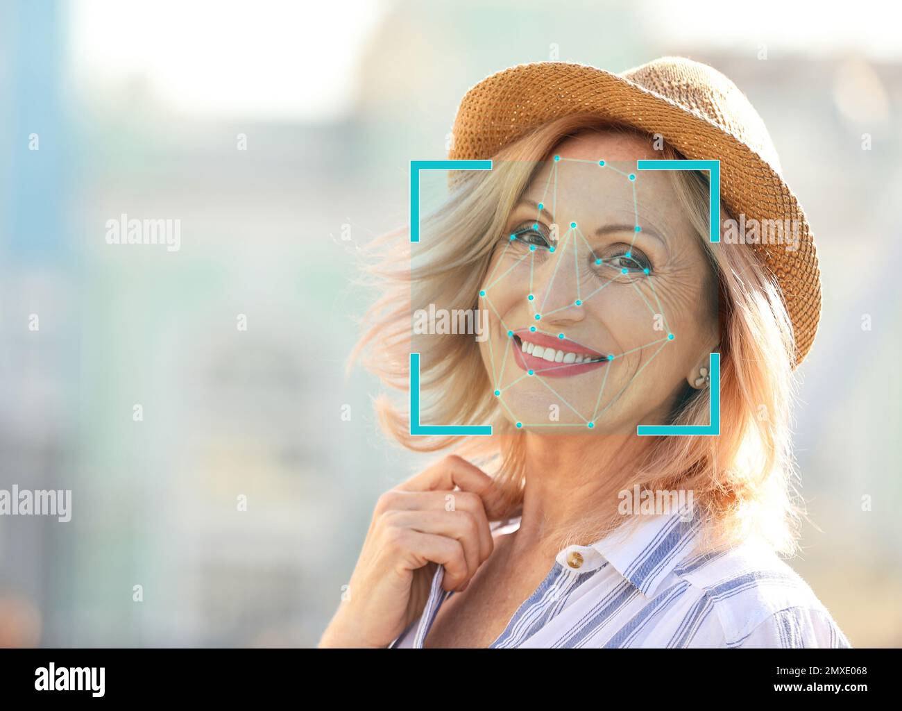 Facial recognition system. Mature woman with scanner frame and digital ...