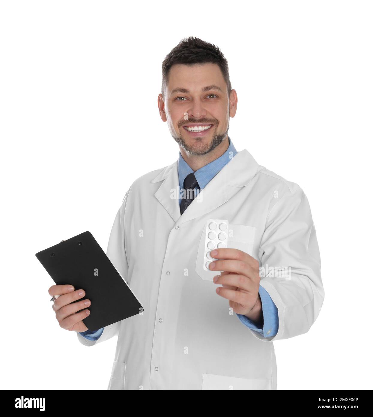 Professional pharmacist with pills and clipboard on white background ...