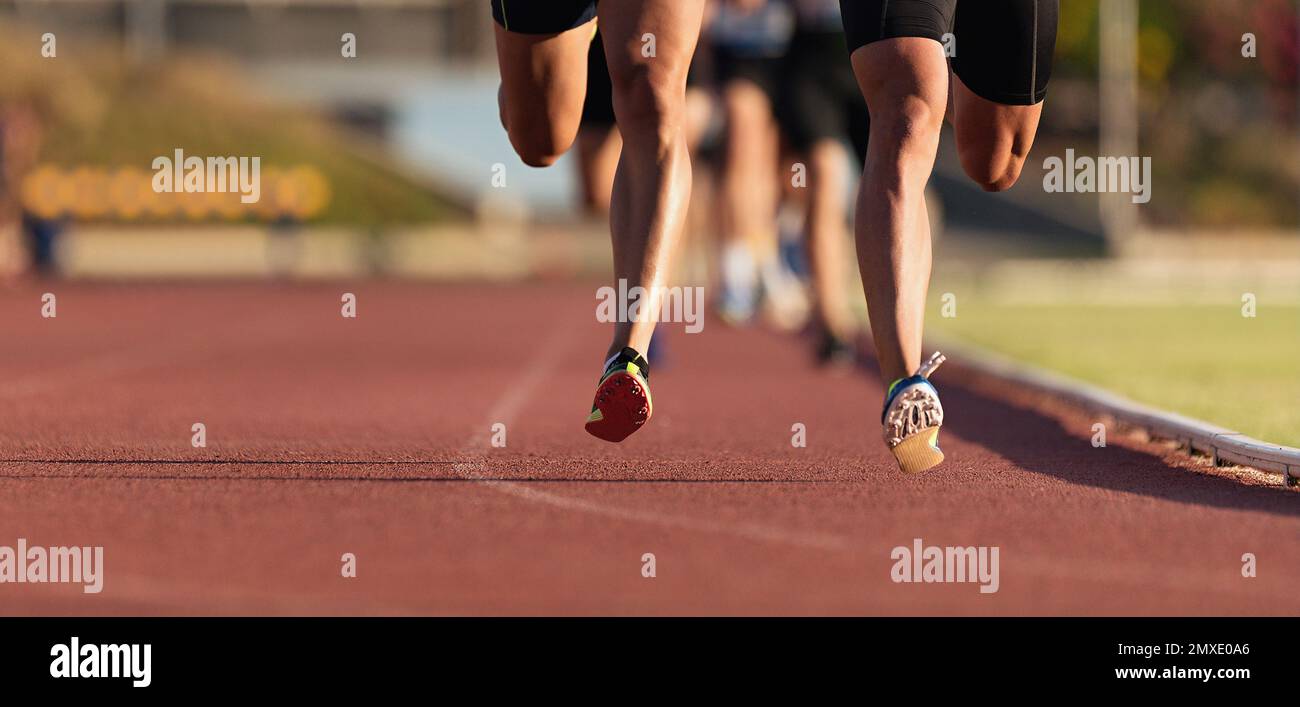 Athletics people running on the track field Stock Photo - Alamy