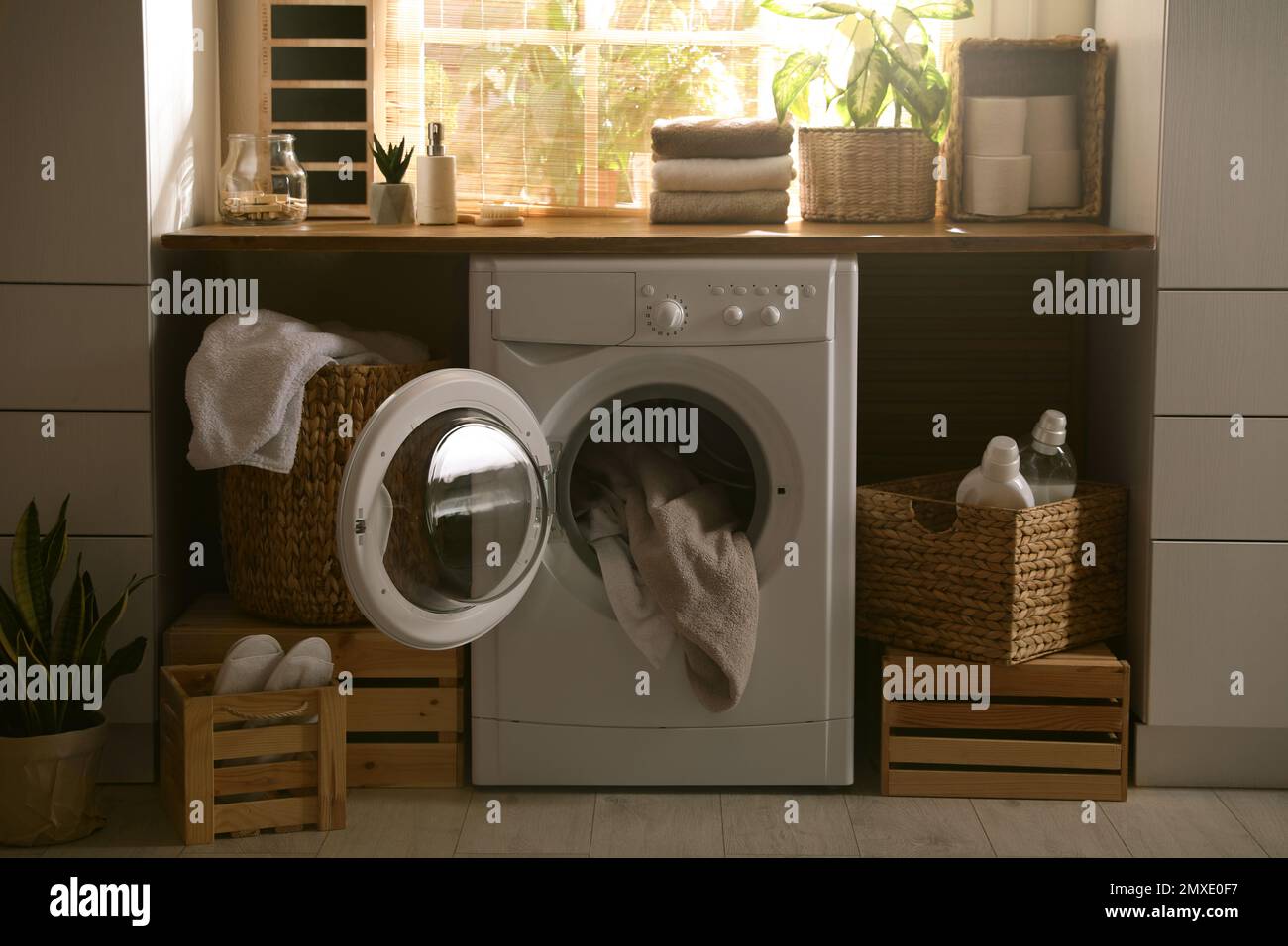 Stylish room interior with washing machine. Design idea Stock Photo - Alamy