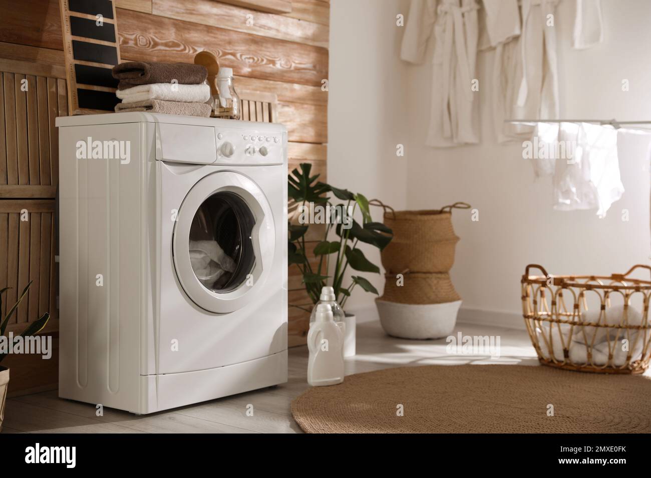 Stylish room interior with washing machine. Design idea Stock Photo - Alamy