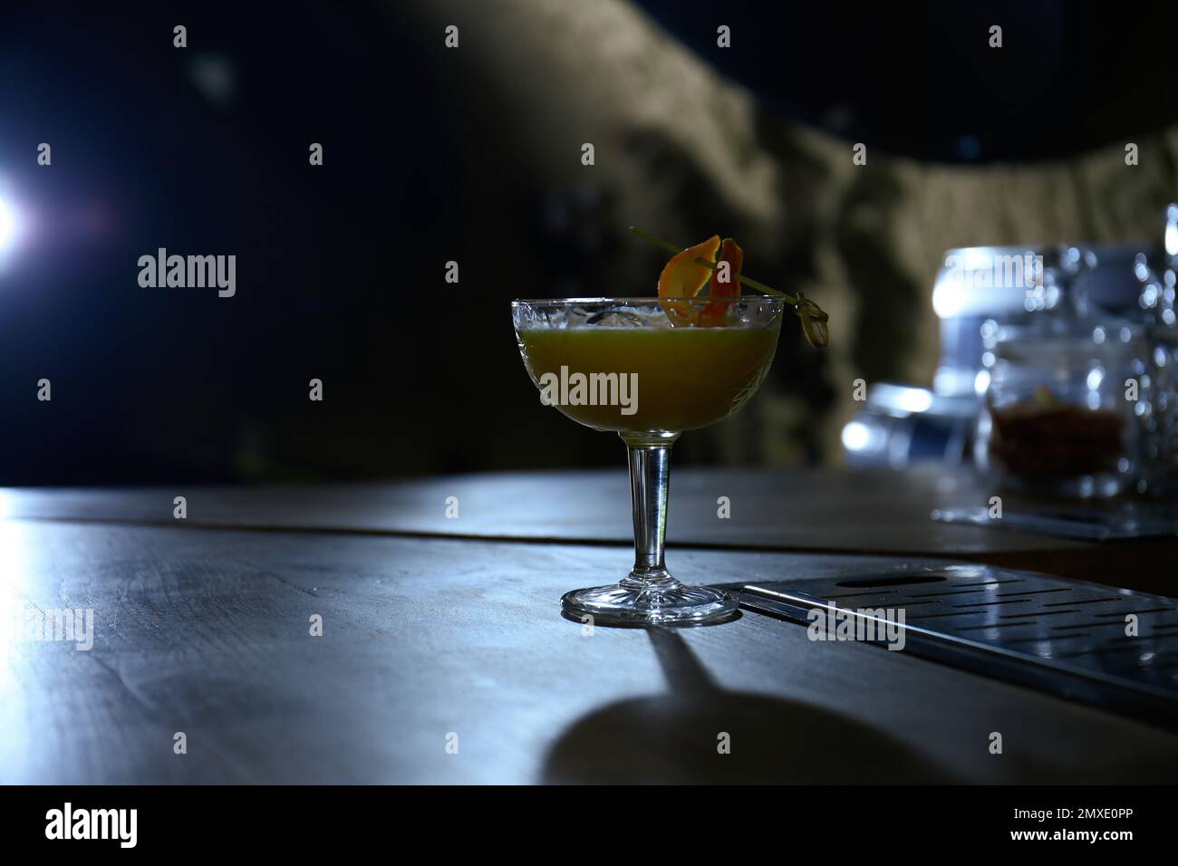 Glass of fresh alcoholic cocktail on bar counter Stock Photo - Alamy
