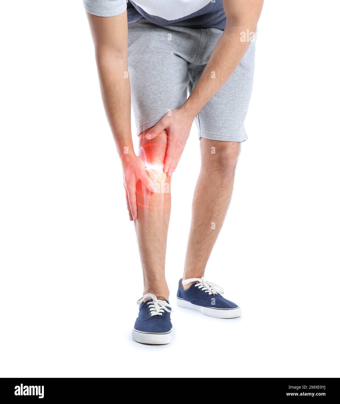 Man suffering from knee pain on white background, closeup Stock Photo ...