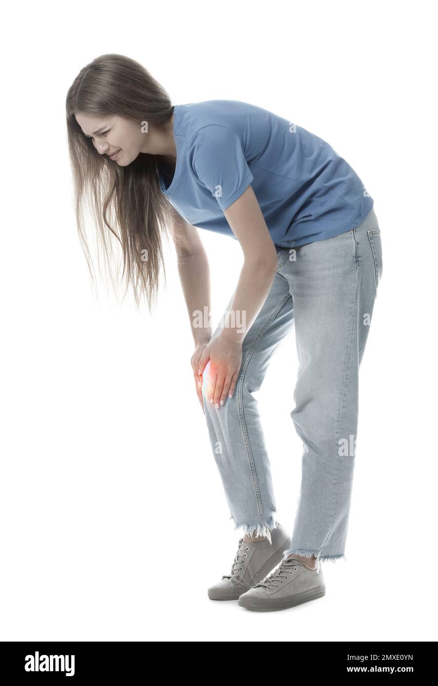 Woman suffering from knee pain on white background Stock Photo - Alamy
