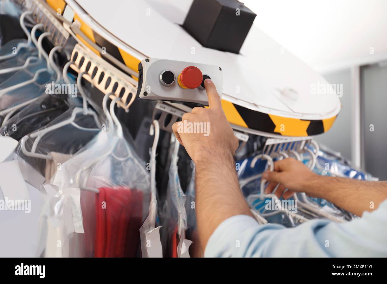 Dry cleaner conveyor hi-res stock photography and images - Alamy