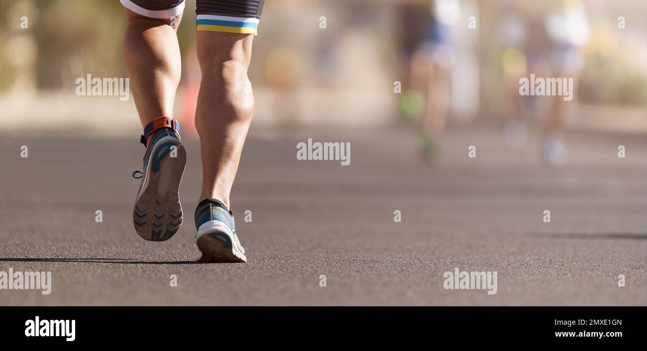 Marathon running race, people feet on city road Stock Photo - Alamy