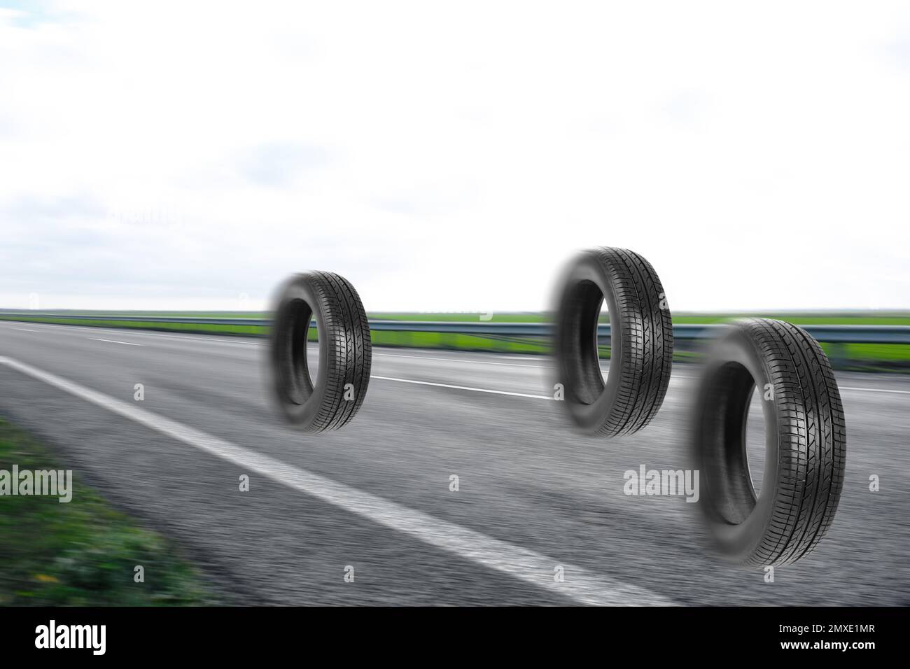 Car tires rolling on asphalt highway outdoors Stock Photo - Alamy