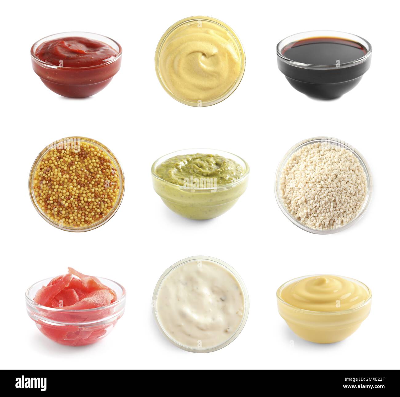 Set of different delicious sauces and condiments on white background ...
