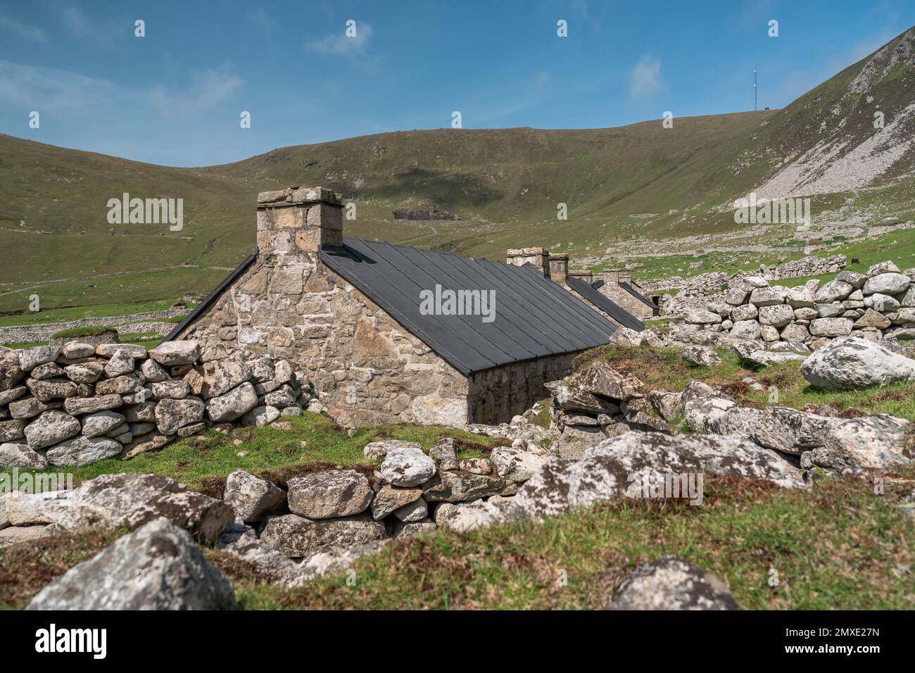 Restored 19th century stone cottages and blackhouse ruins in the old ...