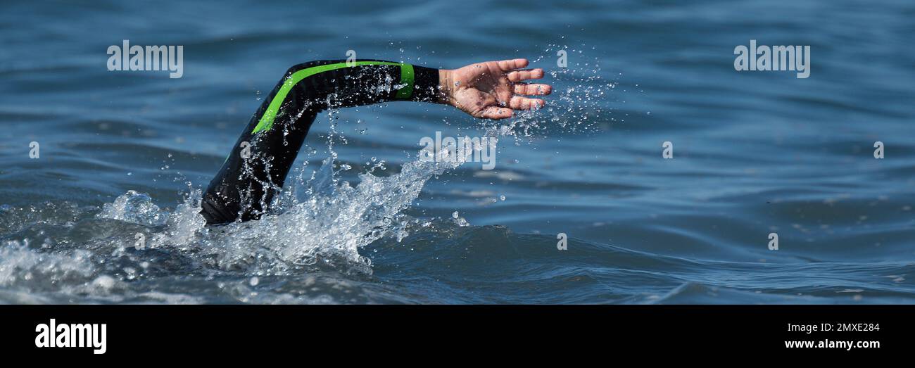 Swimmer floating crawl into the blue sea Stock Photo - Alamy