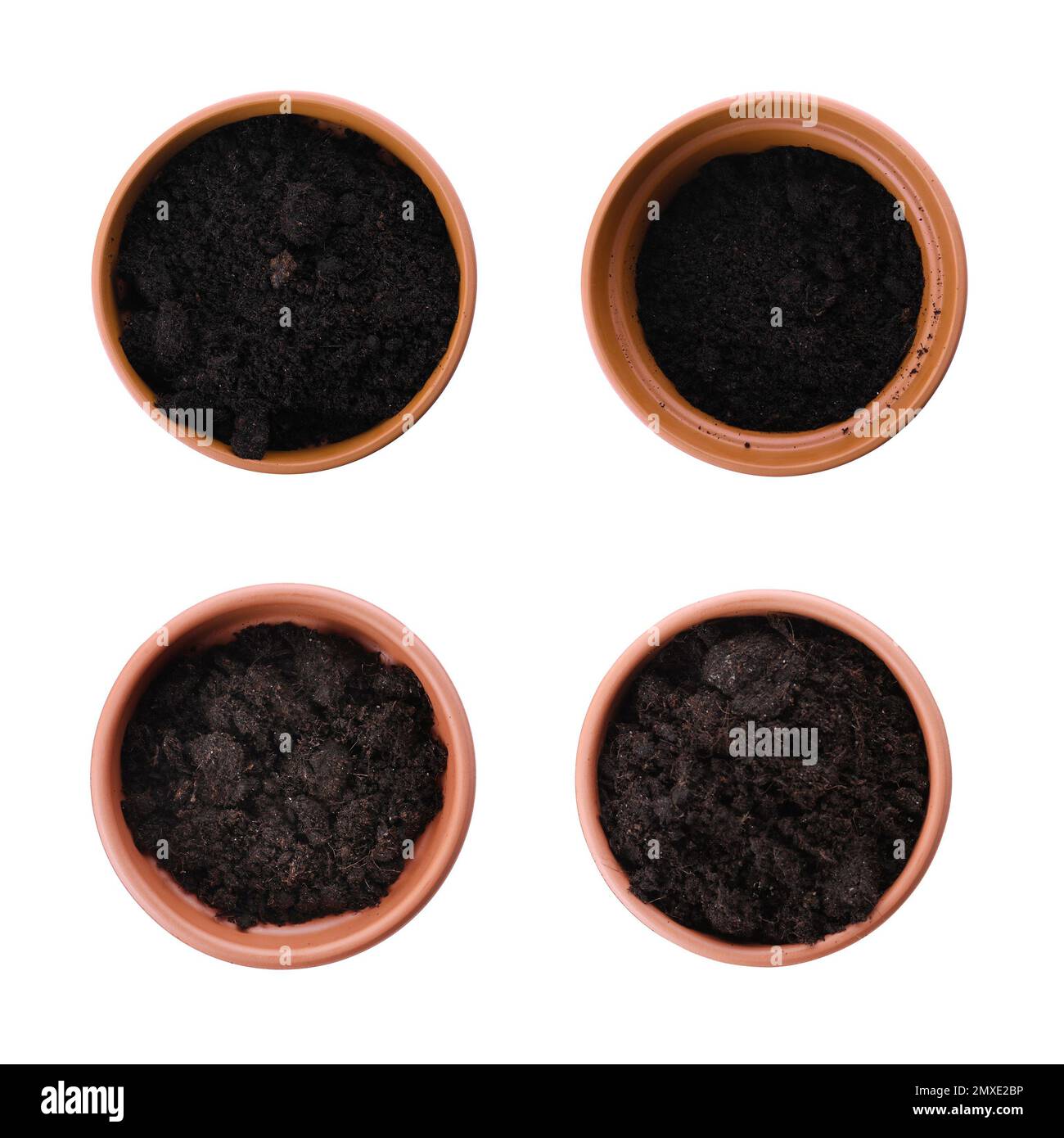 Set of flower pots with soil on white background, top view Stock Photo ...