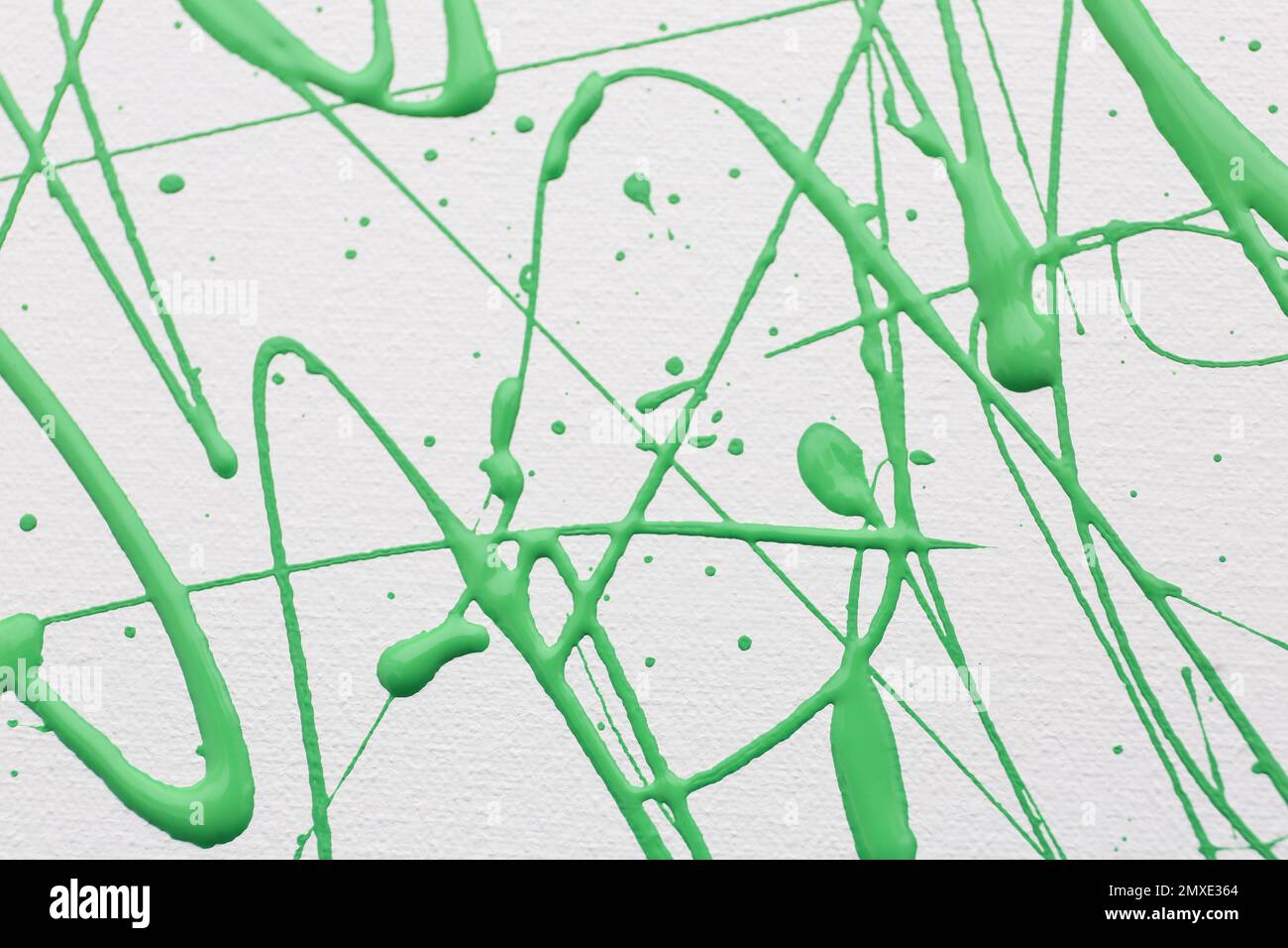 Green paint splashes on white canvas as background. Art and creativity ...