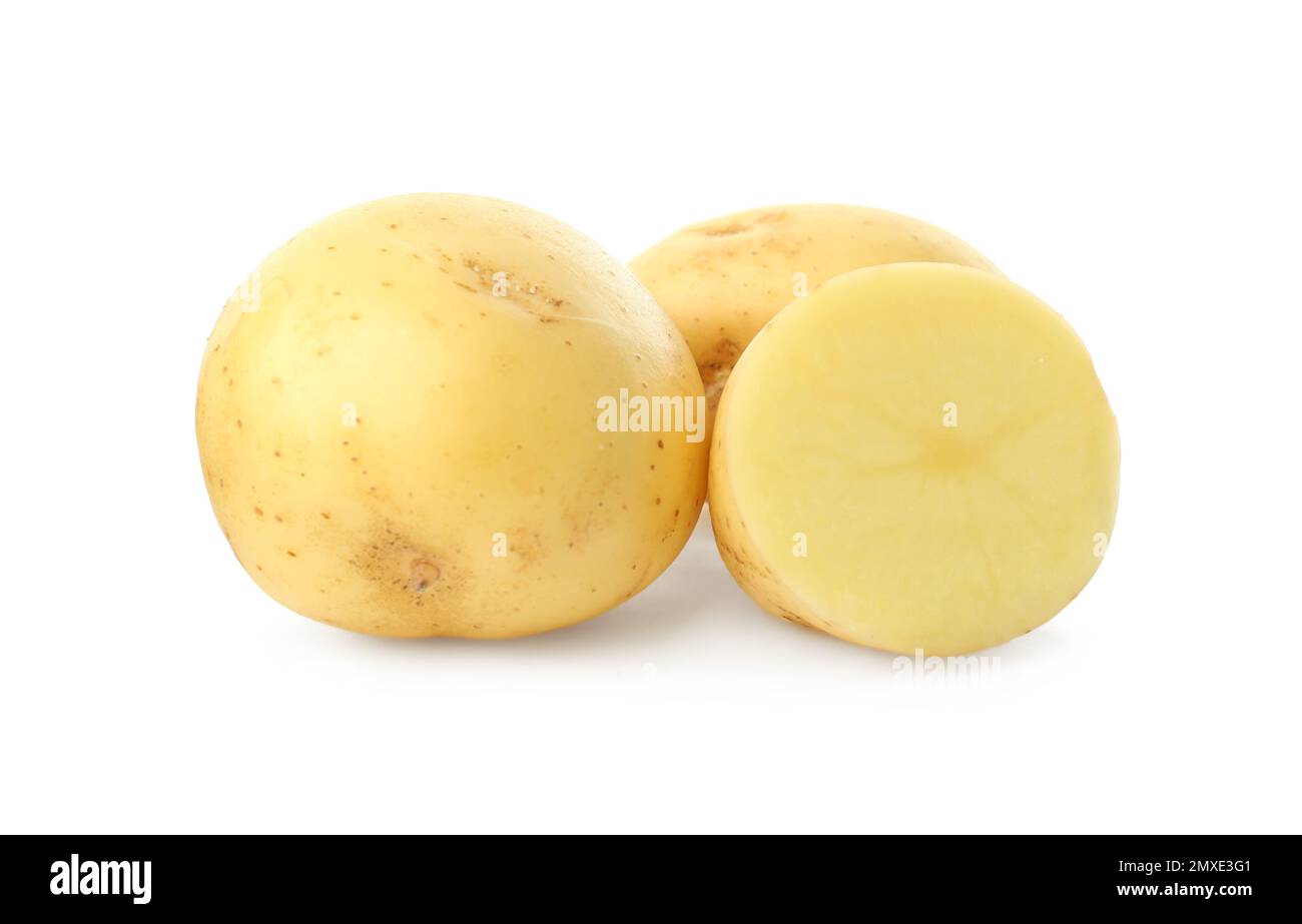 Whole and cut fresh raw organic potatoes on white background Stock ...