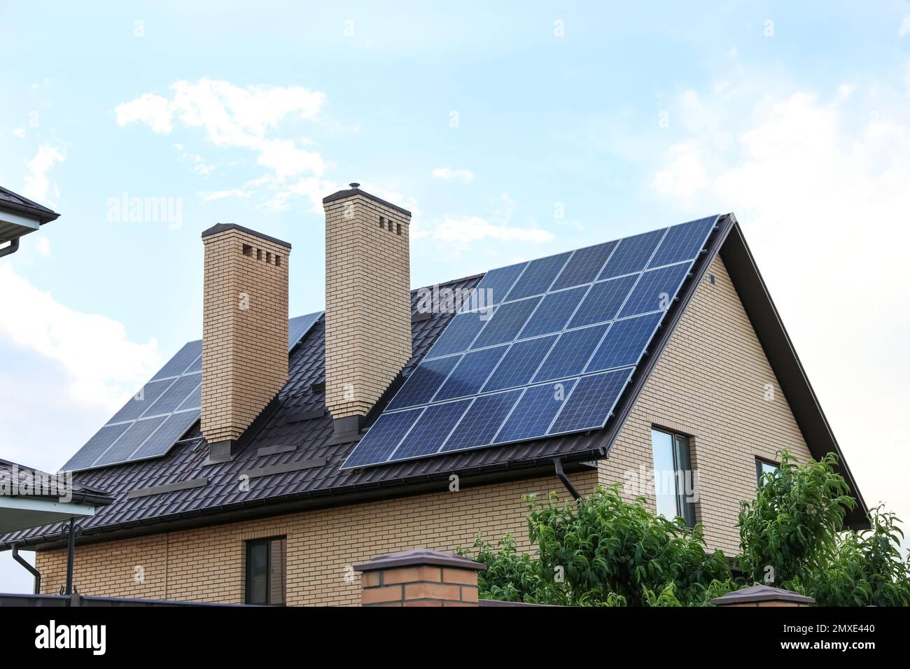 House with installed solar panels on roof Stock Photo - Alamy