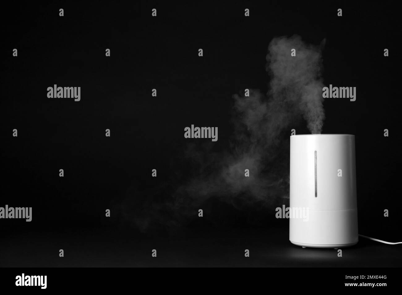 Modern air humidifier on black background. Space for text Stock Photo ...
