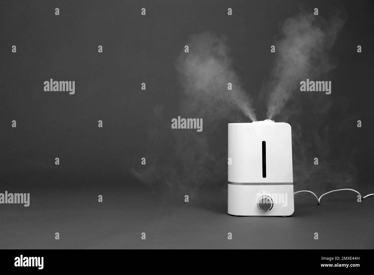 Modern air humidifier on grey background. Space for text Stock Photo ...