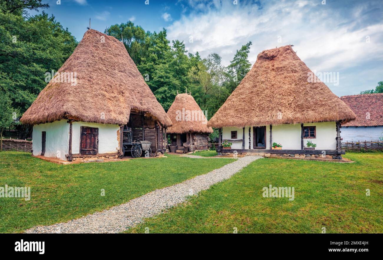 Picturesque summer view of traditional romanian peasant houses ...