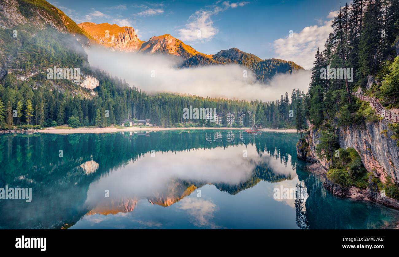 Beautiful summer scenery. Foggy morning view of Braies (Pragser Wildsee ...