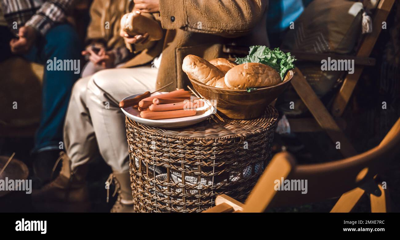 Family trailer travel. Children,brother sister,mom dad fry sausages on ...