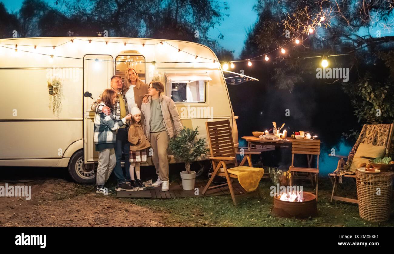 Family trailer travel. Evening with garland. Children,brother sister ...