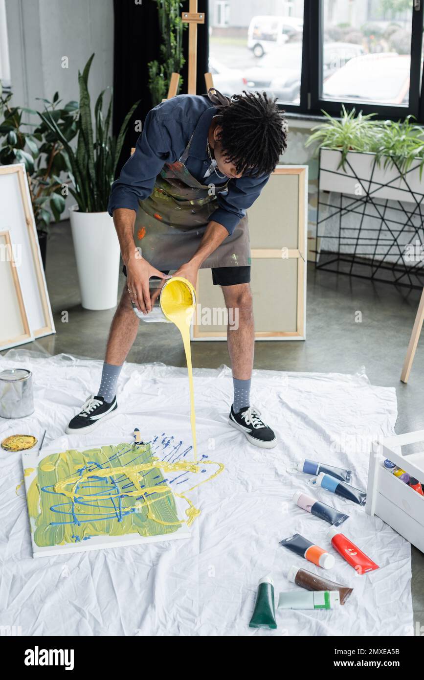 Person pouring yellow paint in hi-res stock photography and images - Alamy