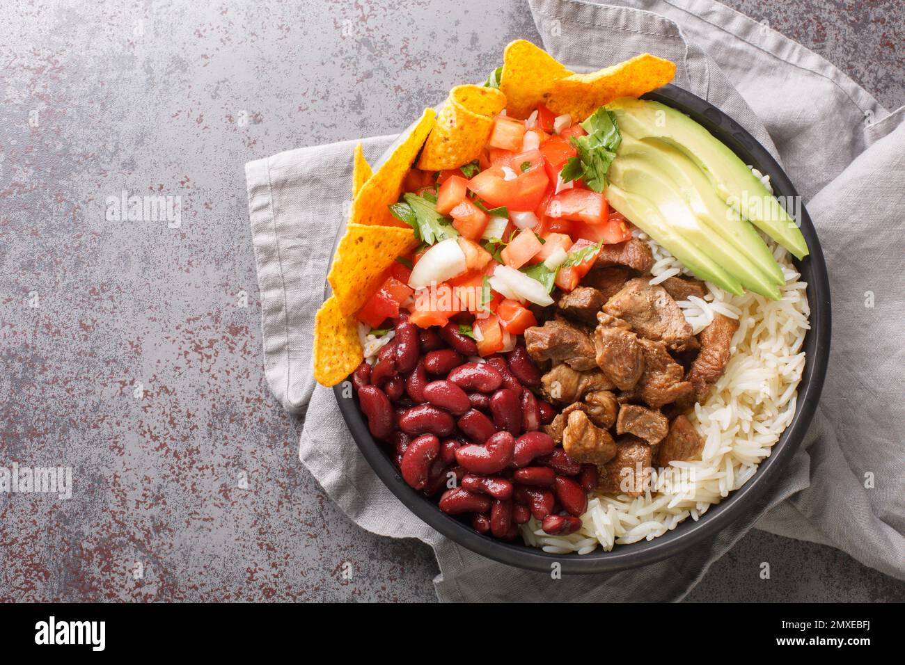 Costa Rican chifrijo is a layered dish of tender beans topped with ...