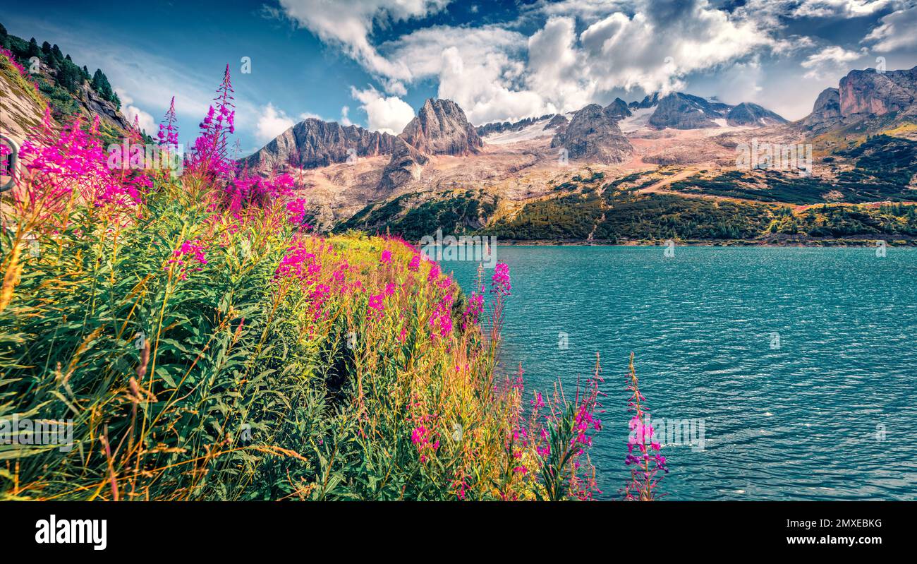 Beautiful summer scenery. Charming morning view of Fedaia lake ...