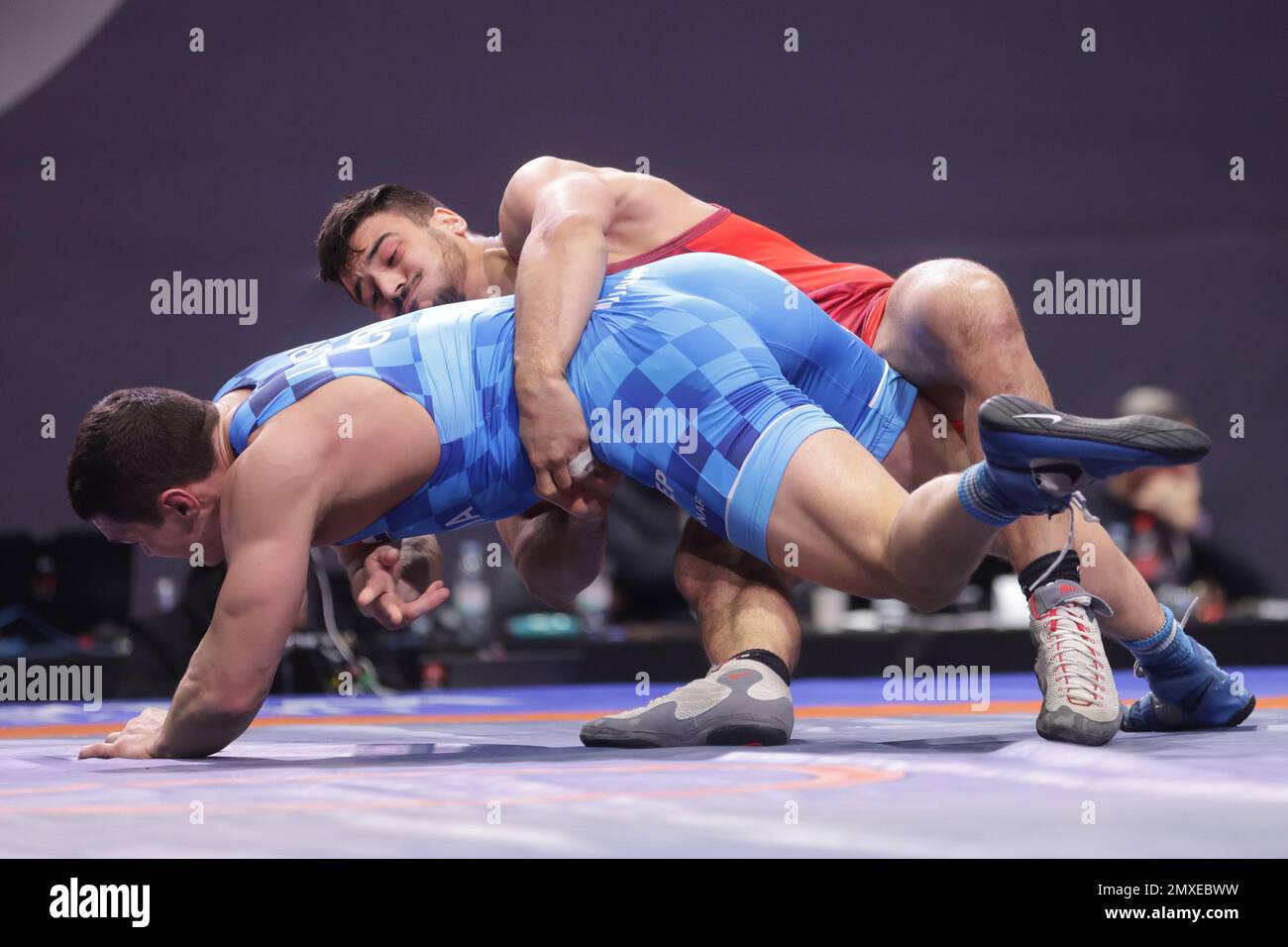 ZAGREB, CROATIA – FEBRUARY 03: Mirco Minguzzi of Italy (red) competes ...