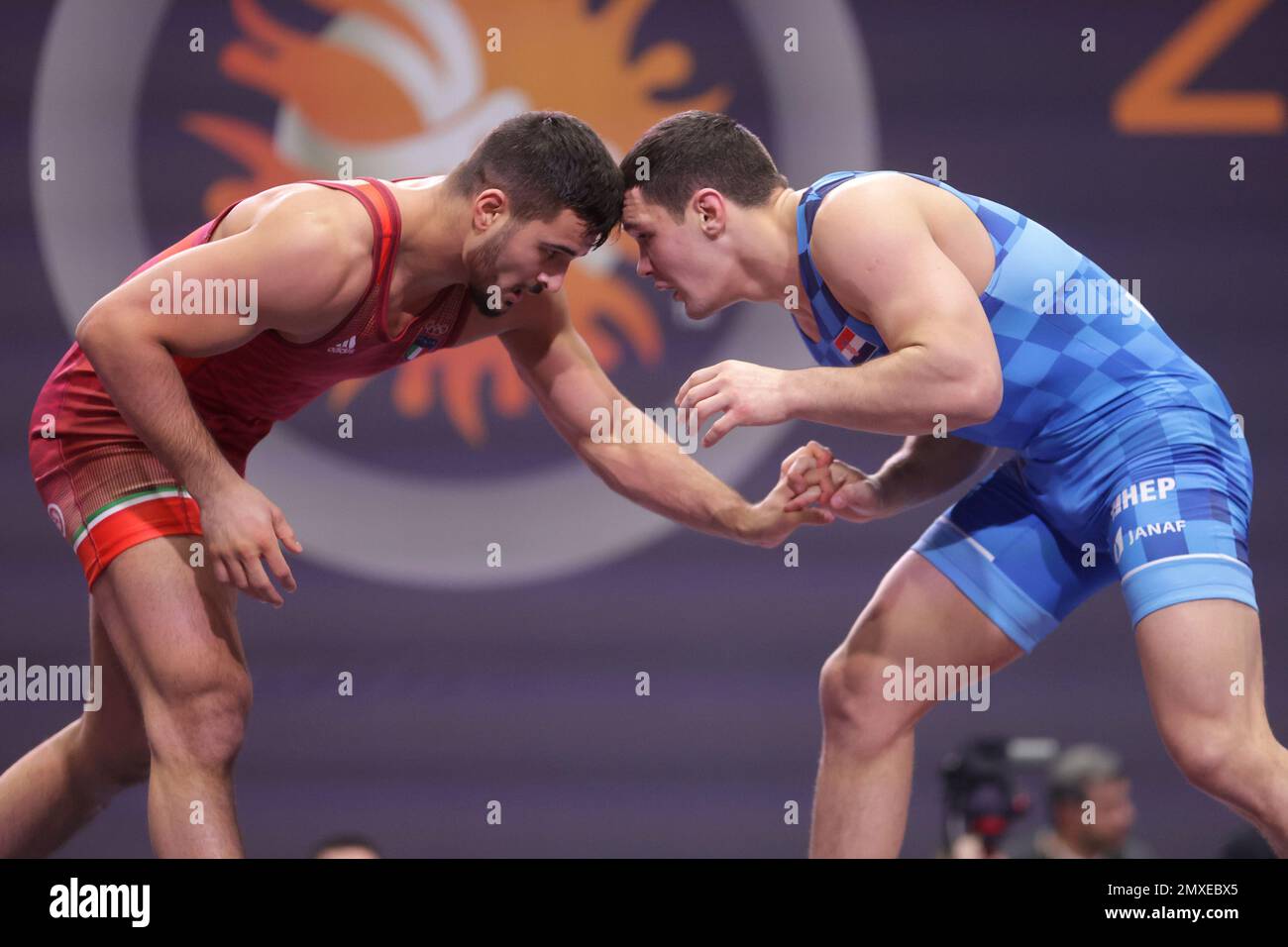 ZAGREB, CROATIA – FEBRUARY 03: Mirco Minguzzi of Italy (red) competes ...