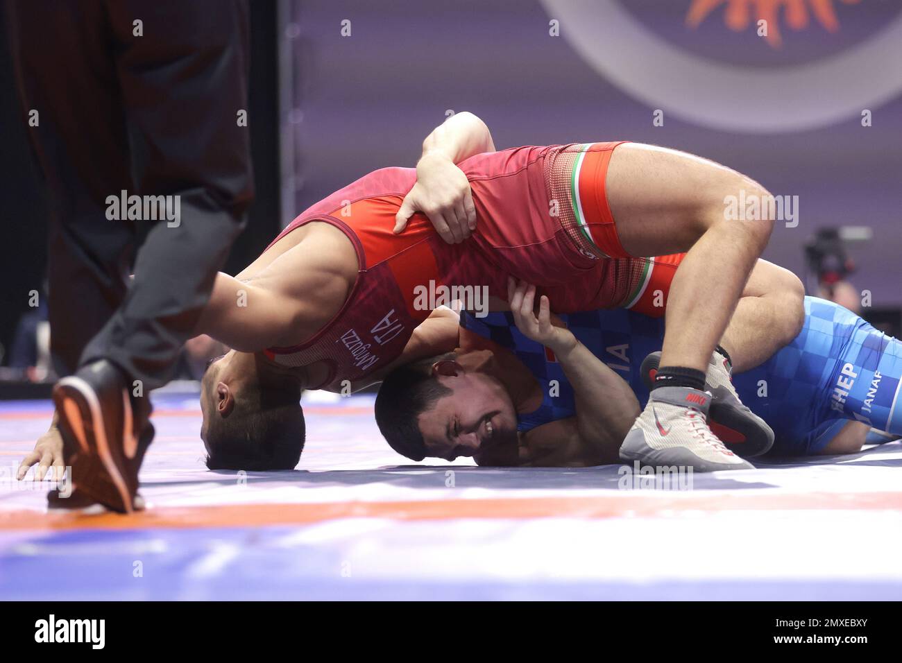 ZAGREB, CROATIA – FEBRUARY 03: Mirco Minguzzi of Italy (red) competes ...