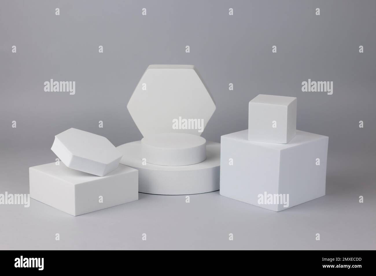 White empty podiums for products display. Abstract minimal scene with ...