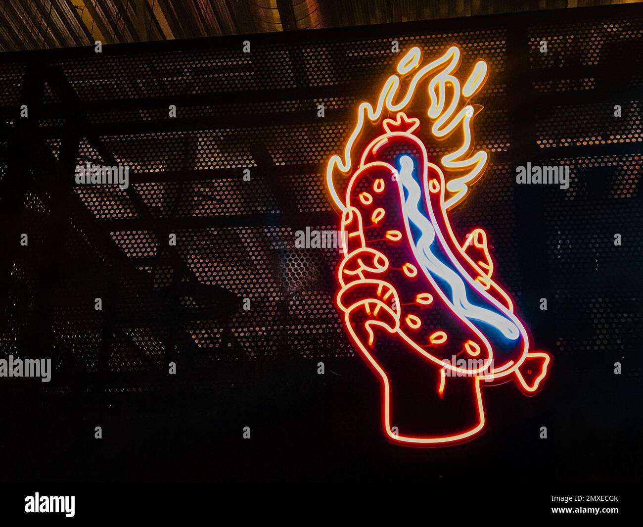 Neon hot dog sign in hand fiery,street food, visitor attraction,red ...