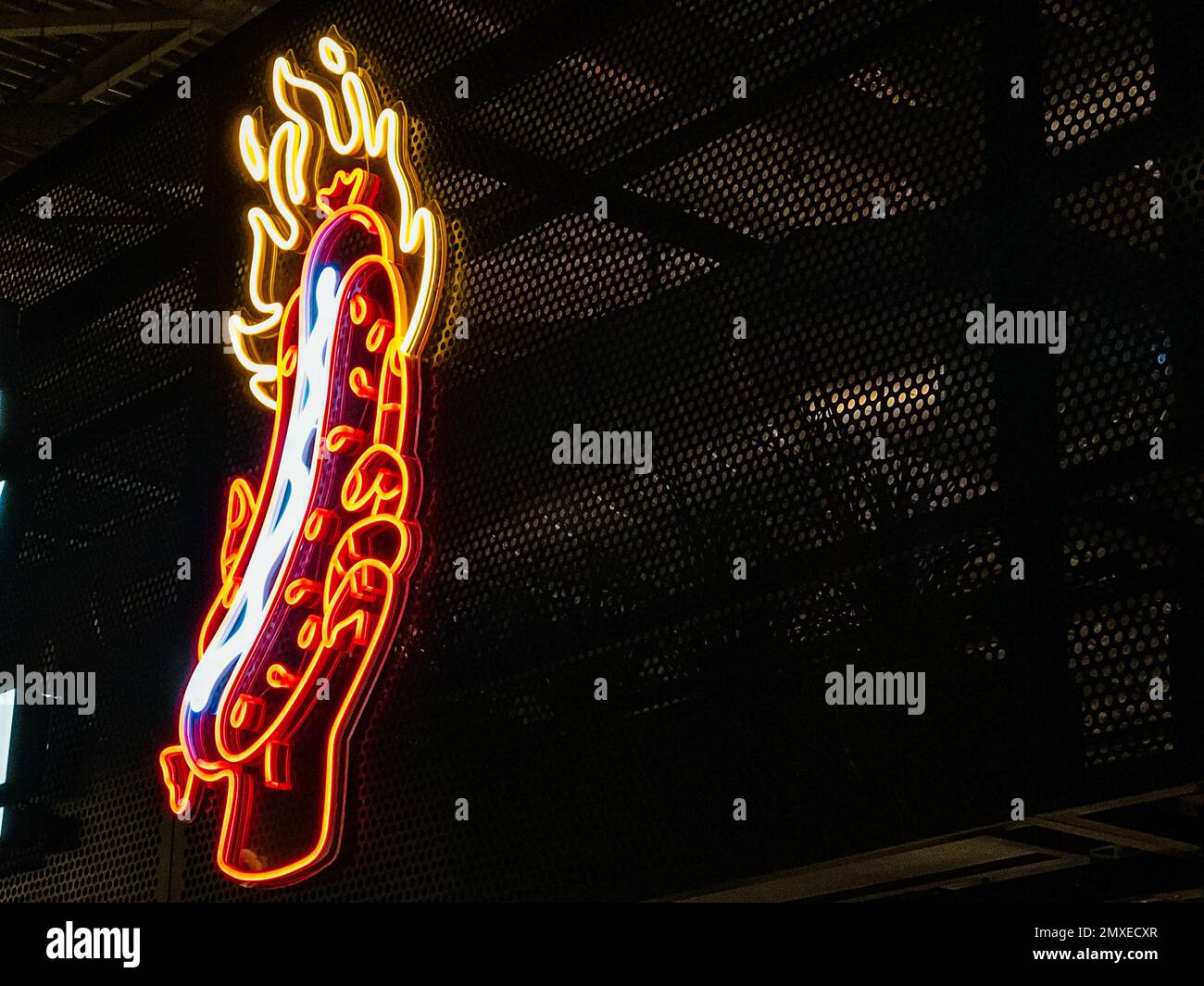 Neon hot dog sign in hand fiery,street food, visitor attraction,red ...