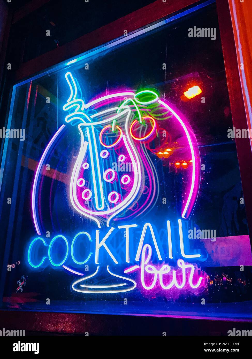 neon sign in the window,cocktail glass,attracting visitors, one object ...
