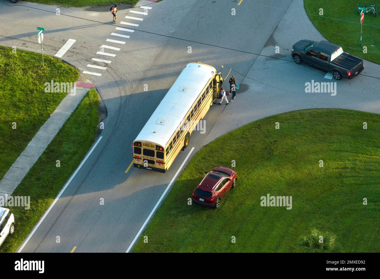 Line of kids getting into school bus hi-res stock photography and ...