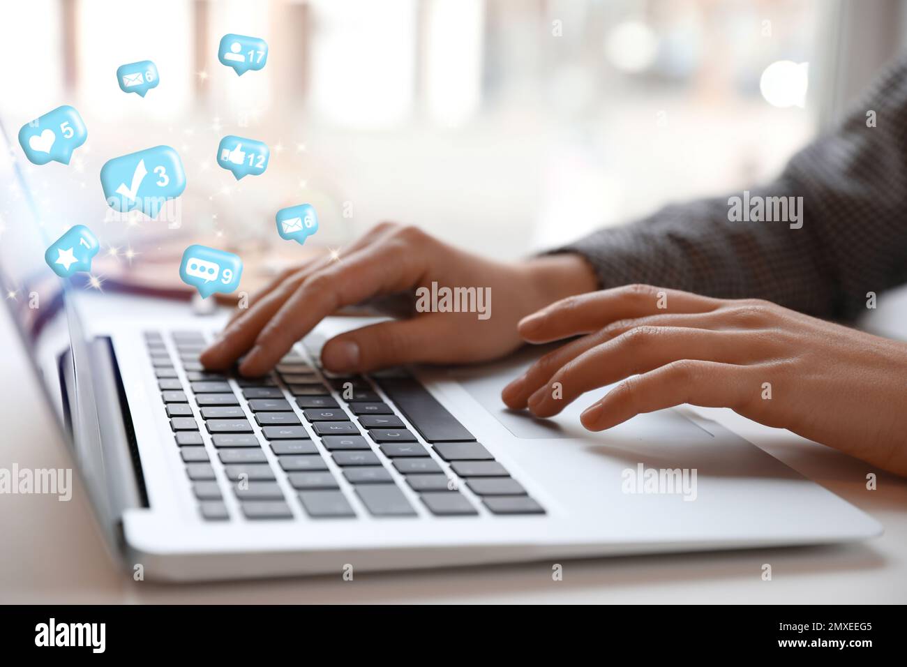 Blogger working with laptop at table indoors, closeup. Social media ...
