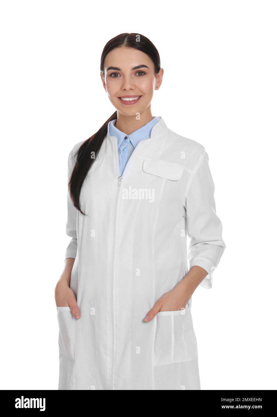 Happy young woman in lab coat on white background Stock Photo - Alamy
