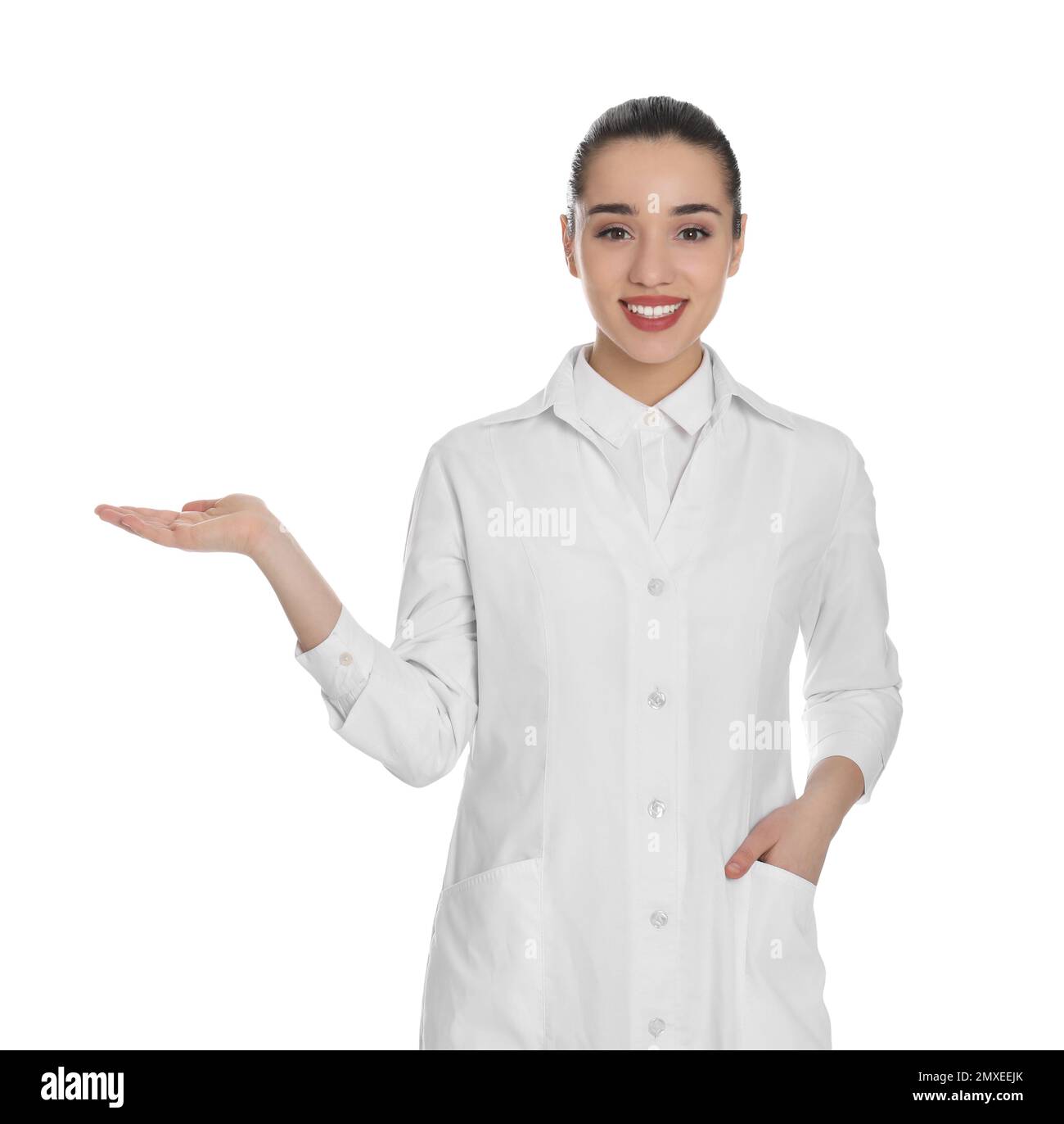Happy young woman in lab coat on white background Stock Photo - Alamy