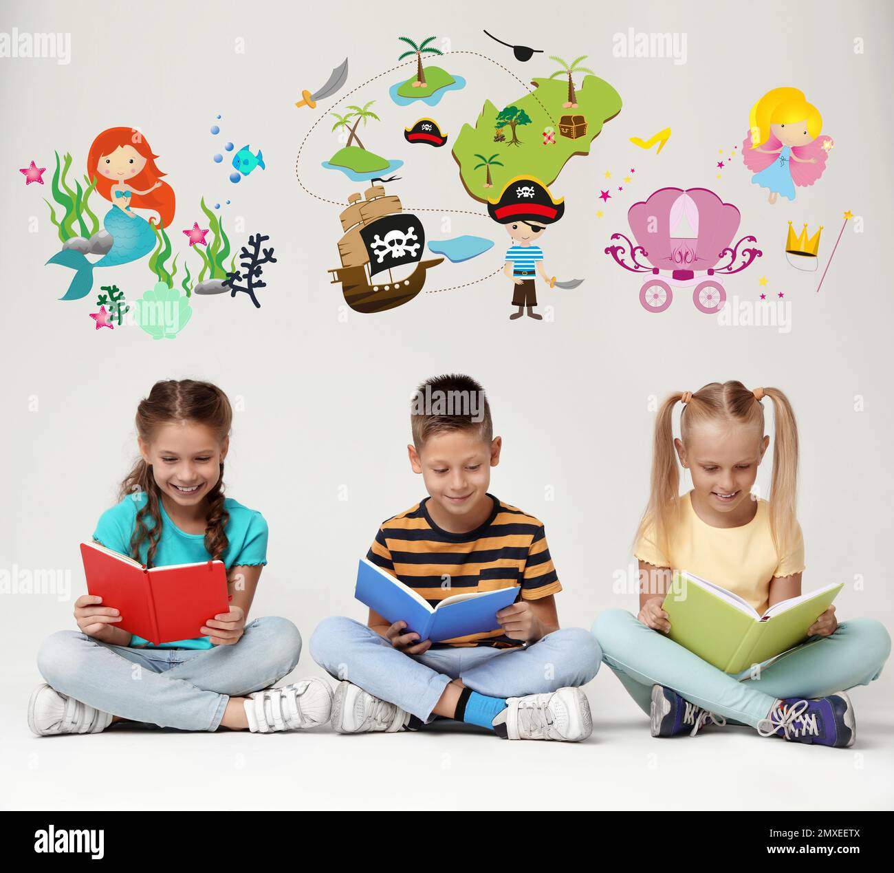 Happy children reading books on grey background Stock Photo - Alamy