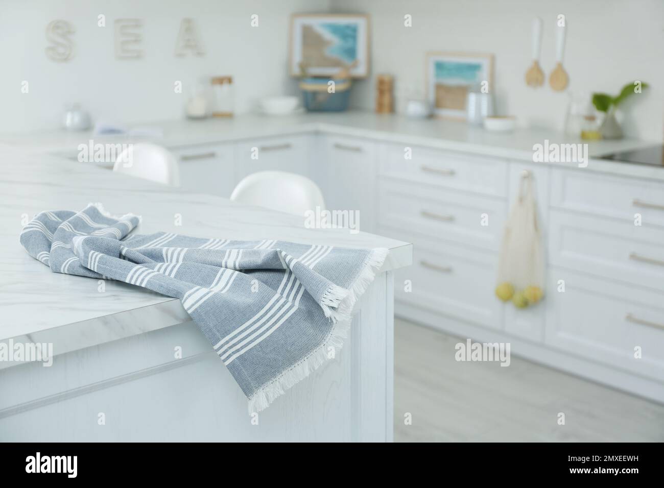 Towel on table in modern kitchen. Interior design Stock Photo - Alamy