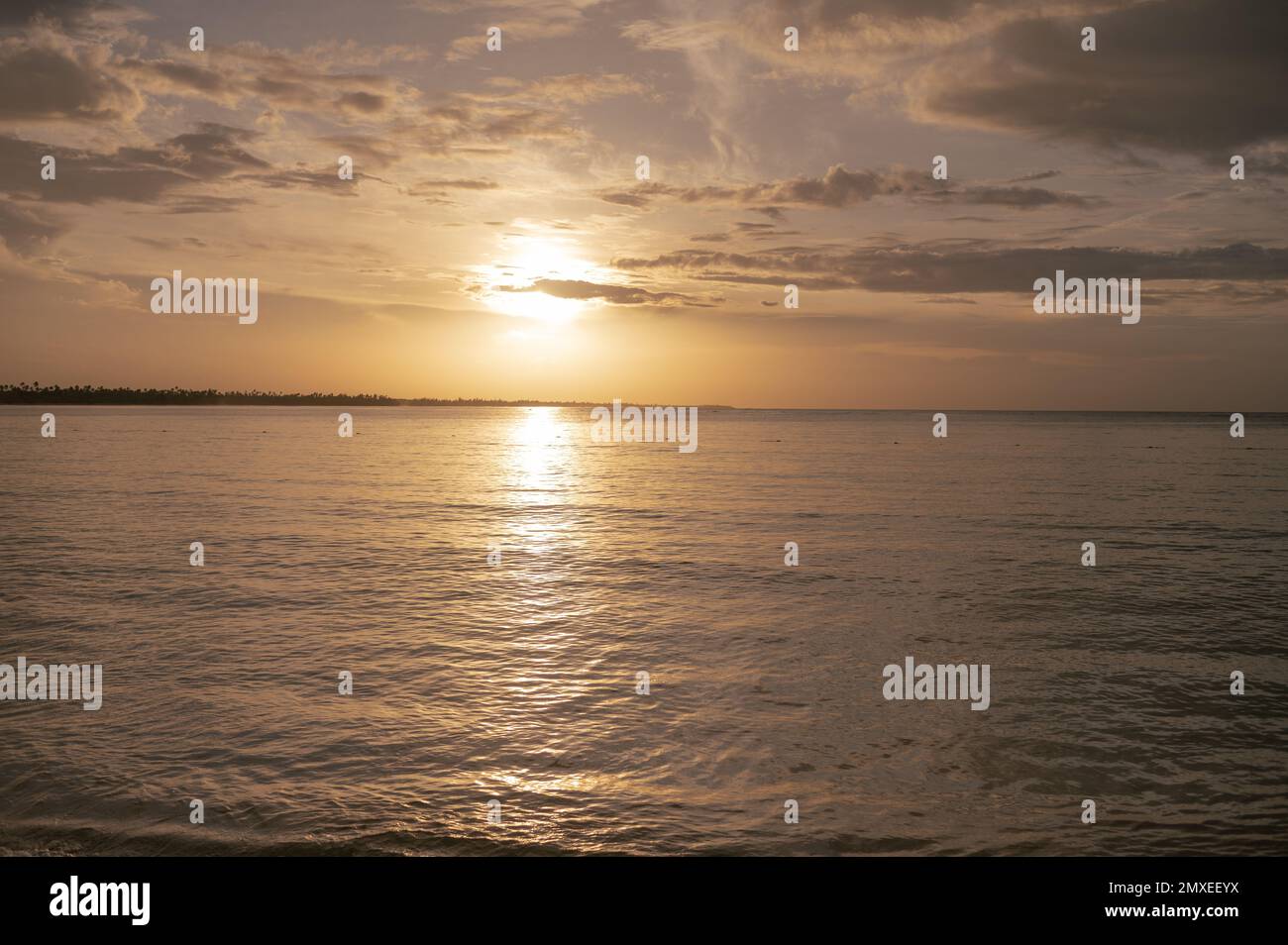 A beautiful view of sunset and its reflection over ocean Stock Photo ...