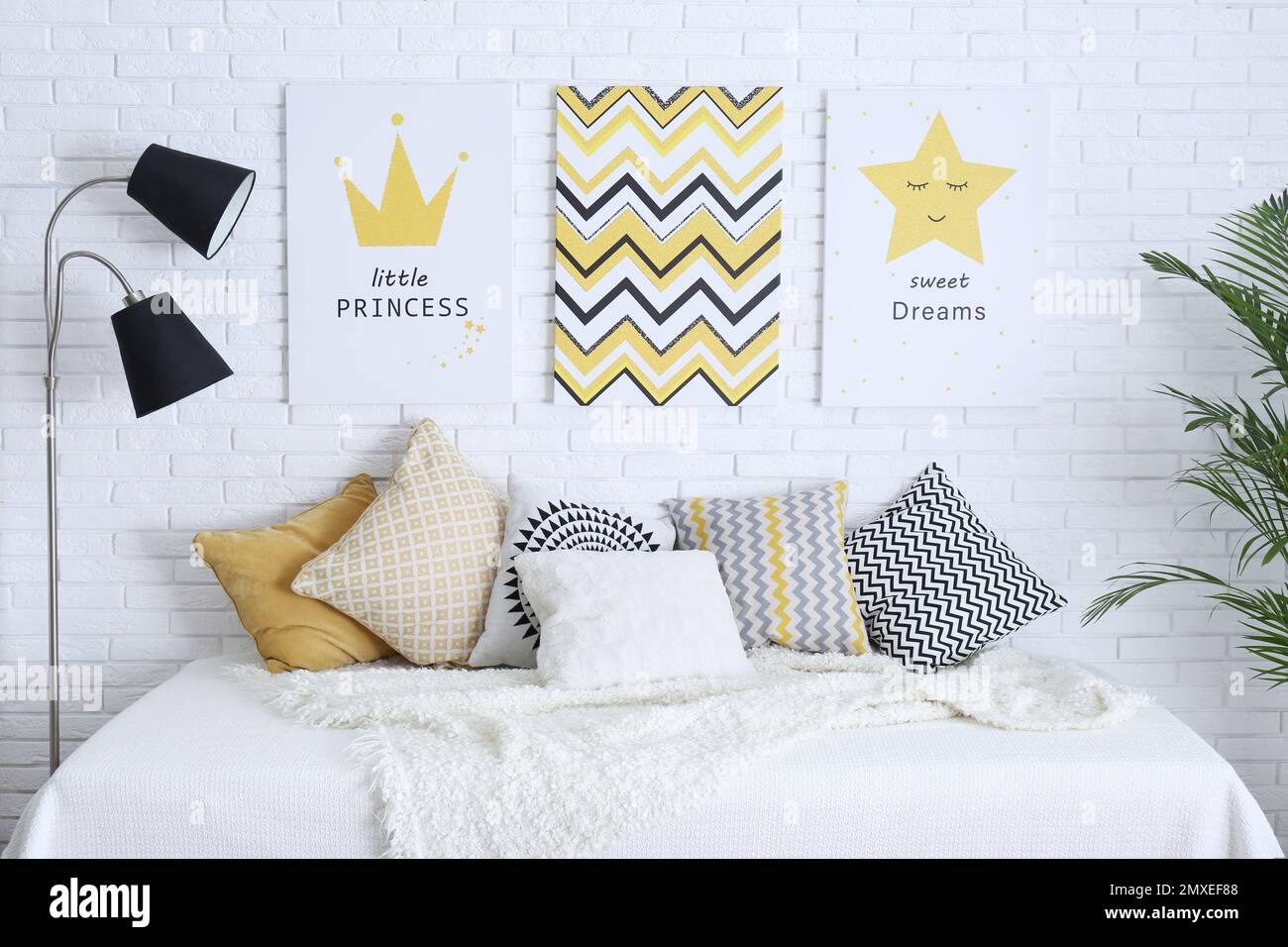 Child's room interior with bed and cute posters on wall Stock Photo - Alamy