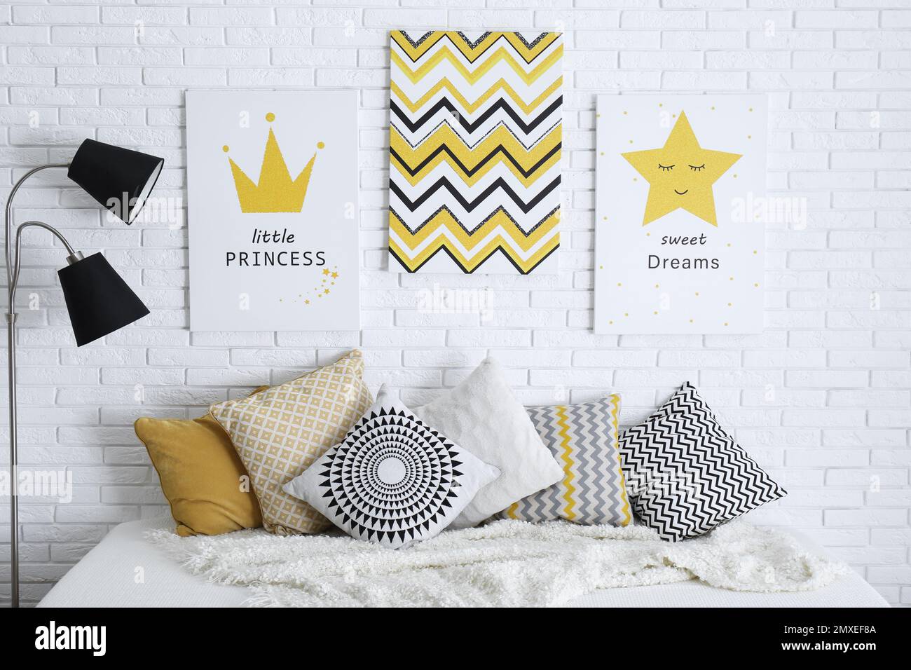 Child's room interior with bed and cute posters on wall Stock Photo - Alamy
