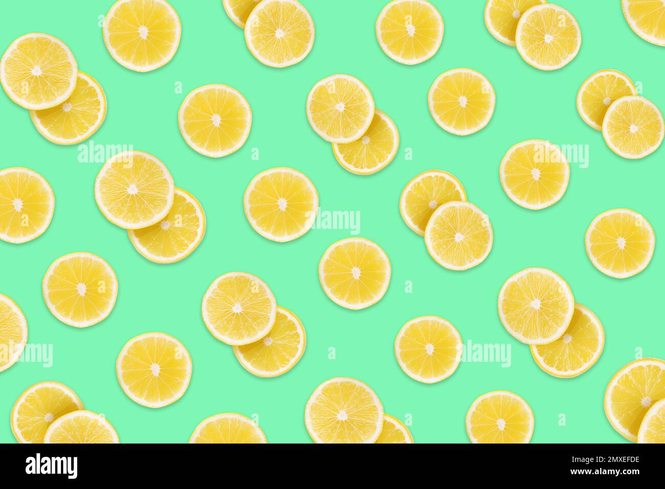 Pattern of lemon slices on aquamarine background Stock Photo - Alamy