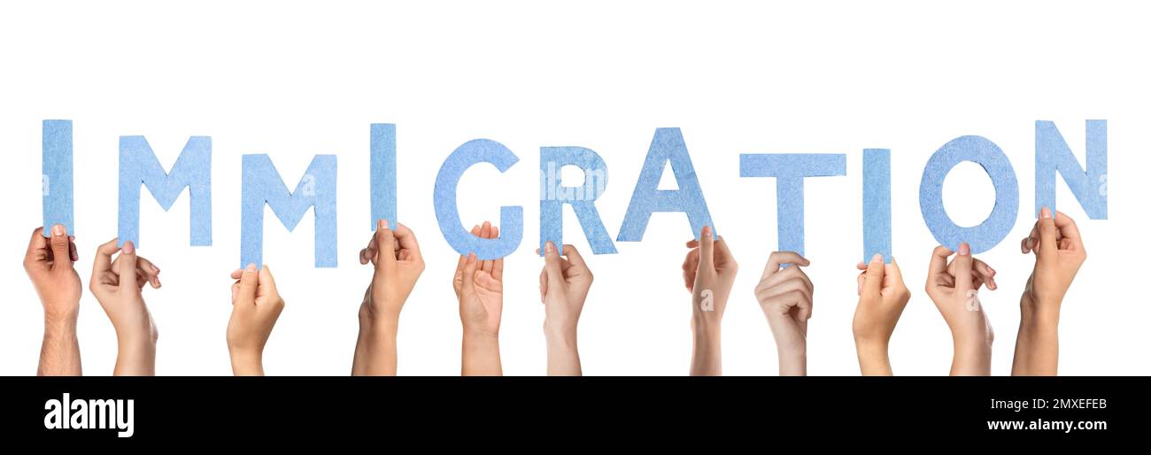 People holding word IMMIGRATION made of cardboard letters on white ...