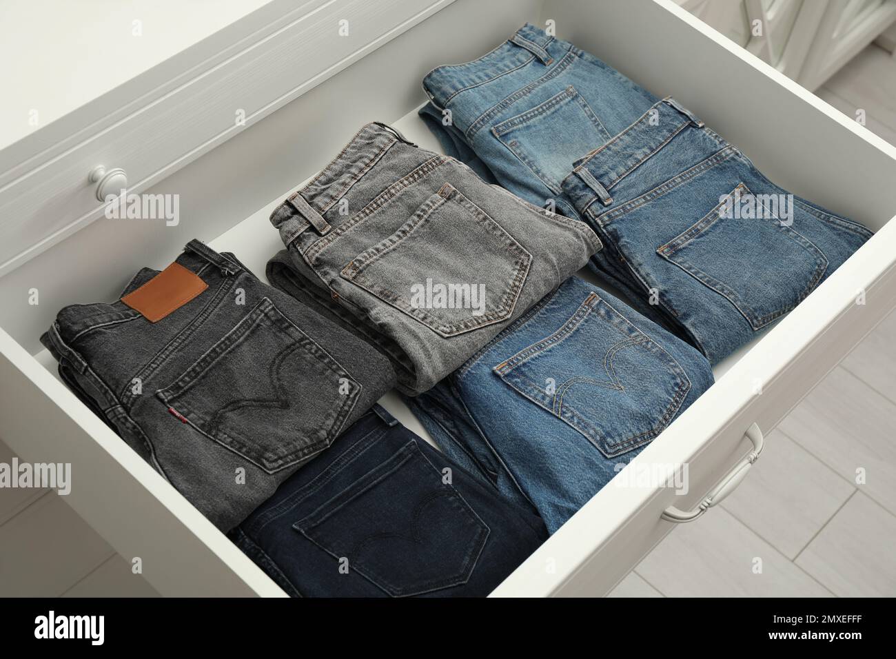 Open wardrobe folded clothes hi-res stock photography and images - Alamy