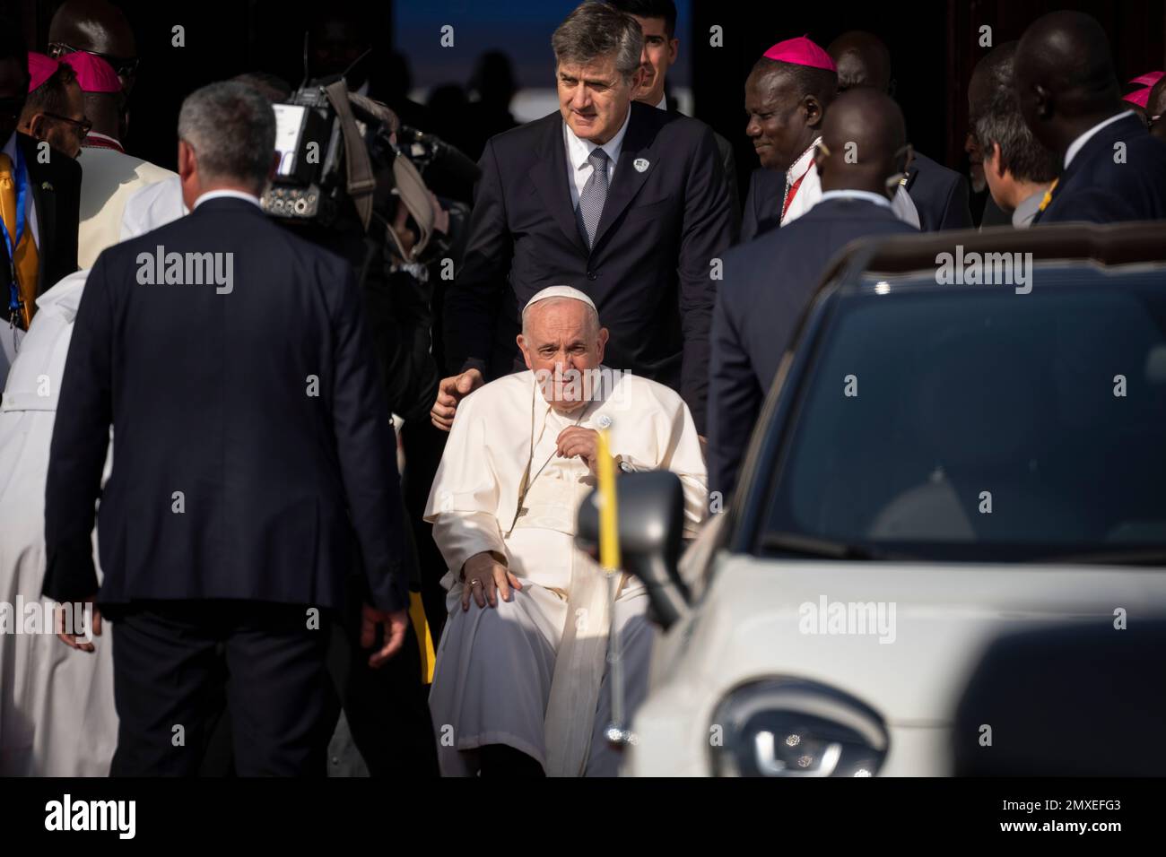 Pope Francis goes to his vehicle at the airport in Juba, South Sudan ...