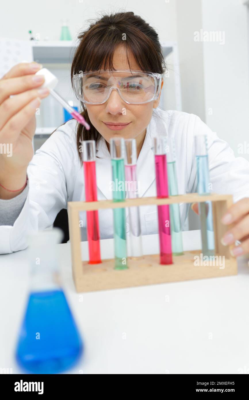 happy woman working in a lab Stock Photo - Alamy